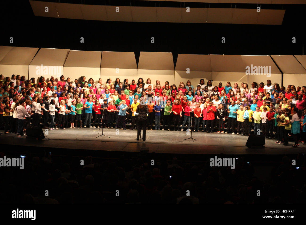Large children choir performing on stage Stock Photo - Alamy