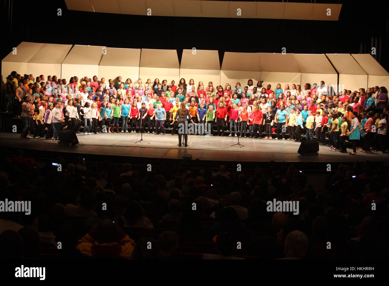Large children choir performing on stage Stock Photo - Alamy