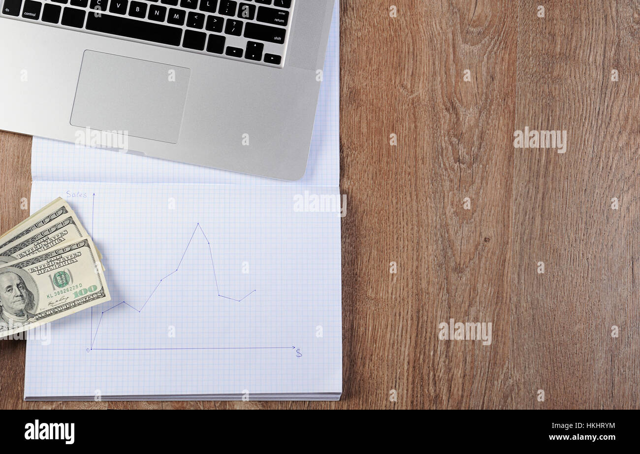 finance notebook with graph schedule diagram dollars money laptop on ...