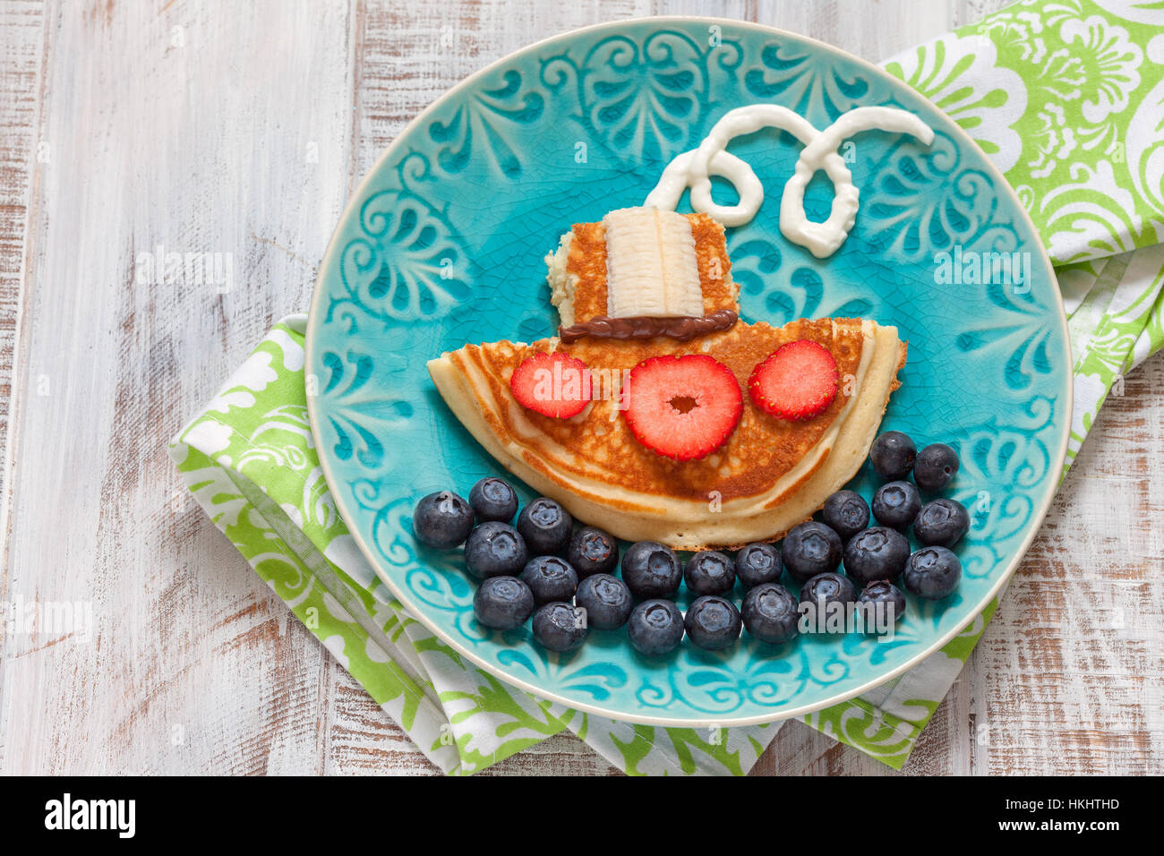 Ship boat pancake with berries for kids breakfast Stock Photo - Alamy