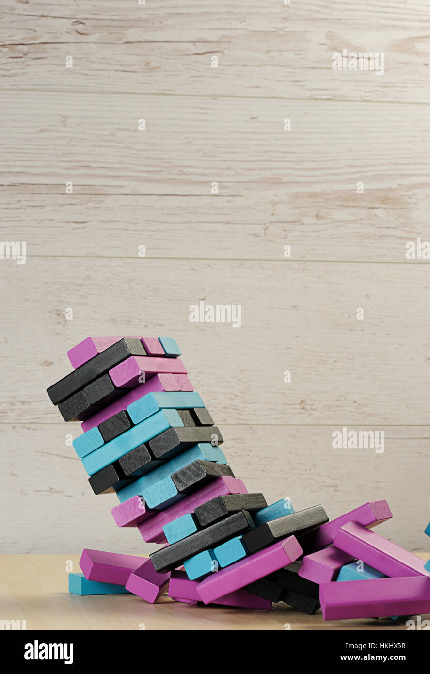 jenga tower fall color on wood table Stock Photo - Alamy