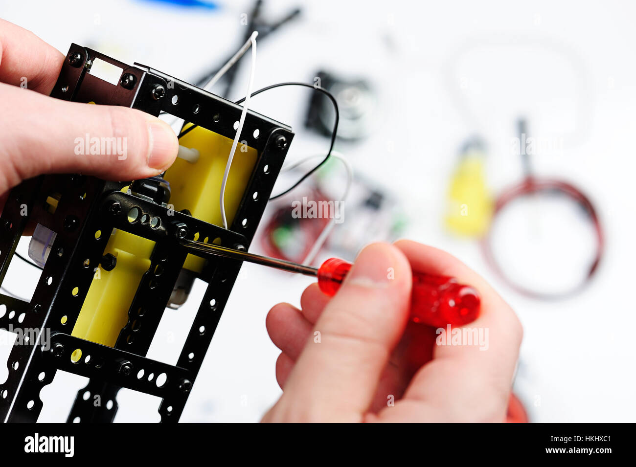 person assemble robot details close up Stock Photo - Alamy