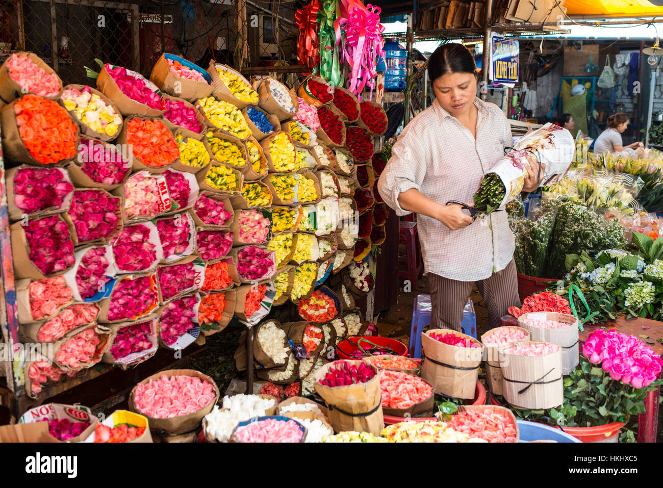 Vietnamese woman in the Saigon flower market Stock Photo - Alamy