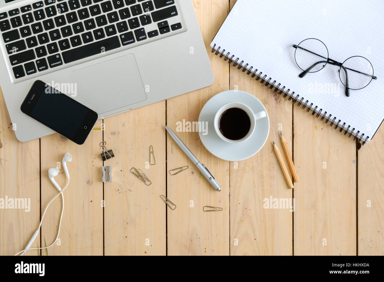Wooden desk with various gadgets and accessories Stock Photo - Alamy