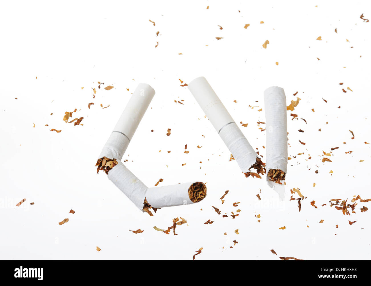 broken on half cigarette isolated on white background Stock Photo - Alamy