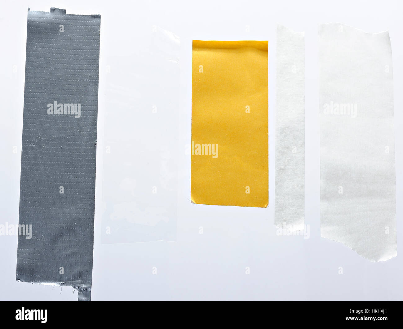 sticky cut tape pieces isolated on white background Stock Photo - Alamy