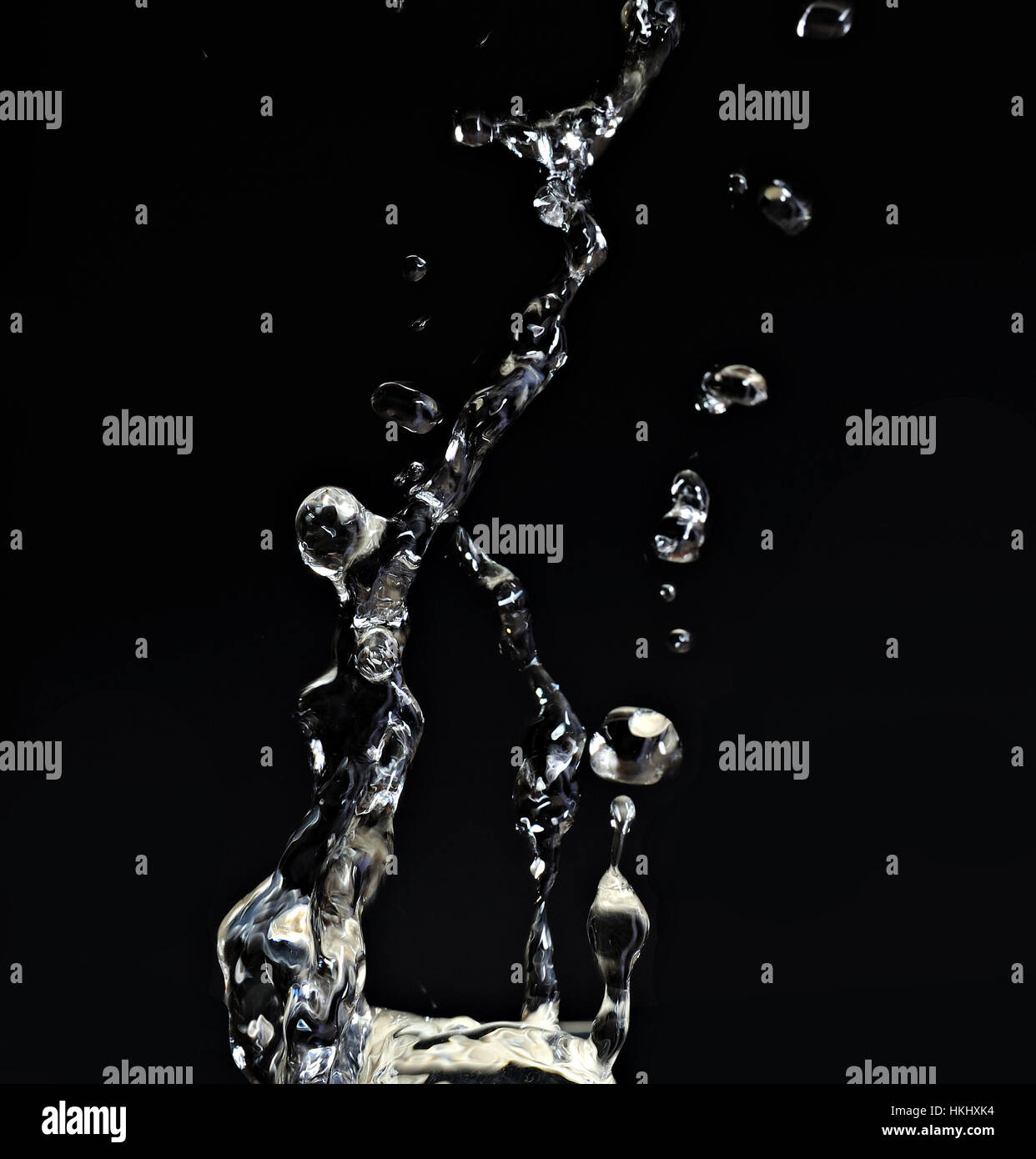 macro of water splash isolated on black background Stock Photo - Alamy