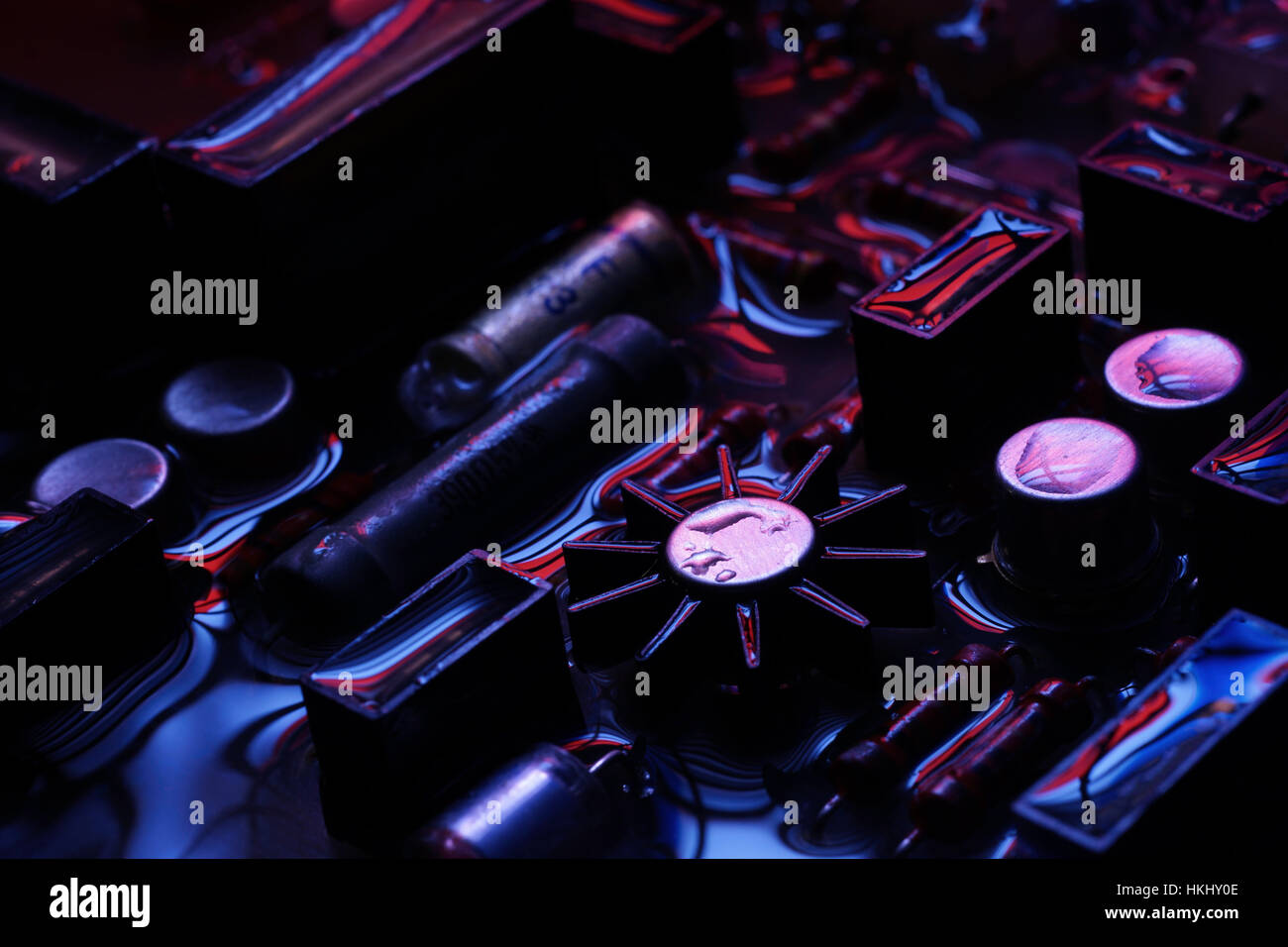 Closeup of electronic hardware. assembly on the circuit board with dark ...
