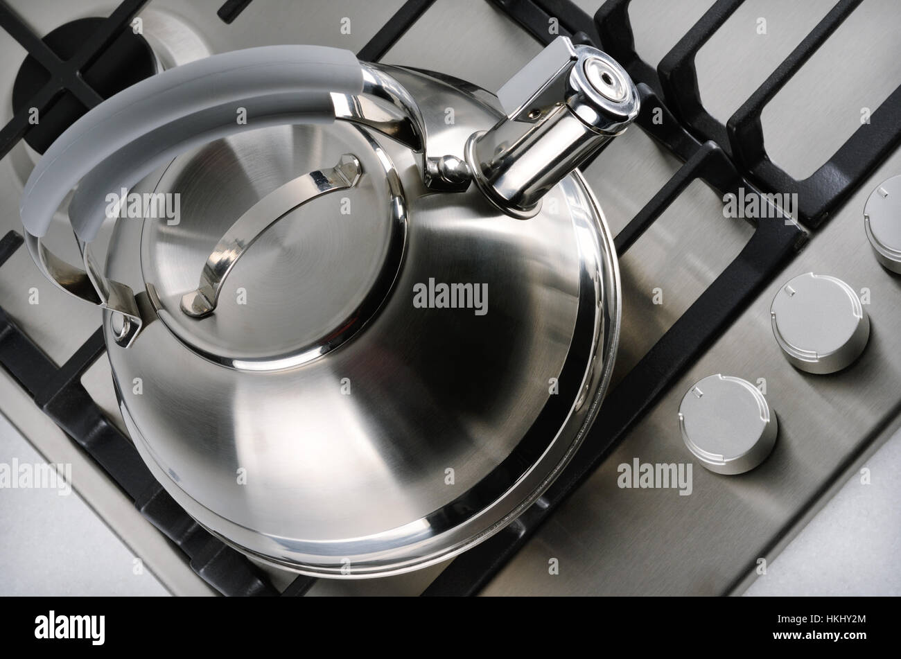 Tea kettle on gas stove. Top view Stock Photo - Alamy