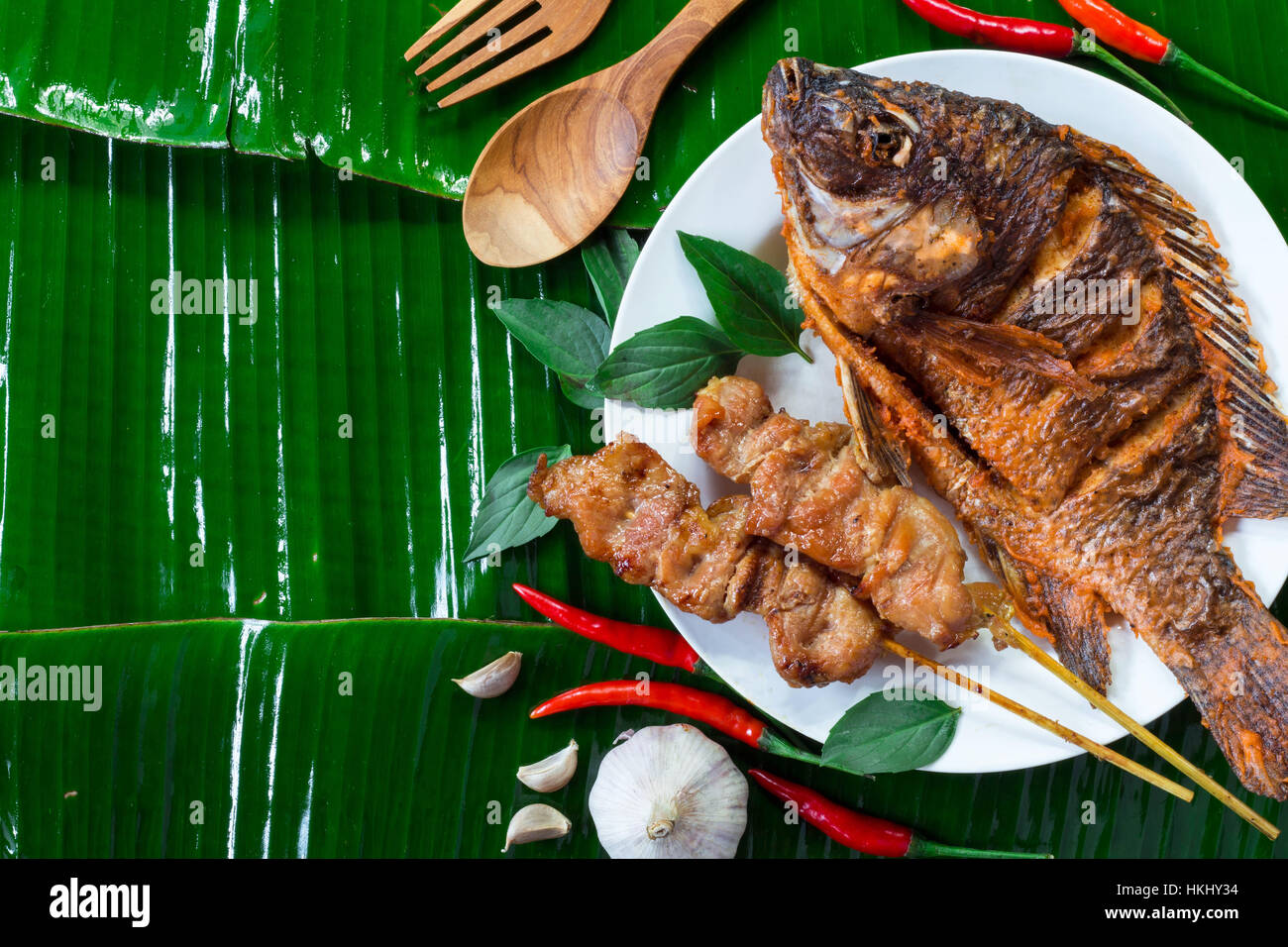 Delicious food, fish fried and roasted pork with vegetable Stock Photo ...