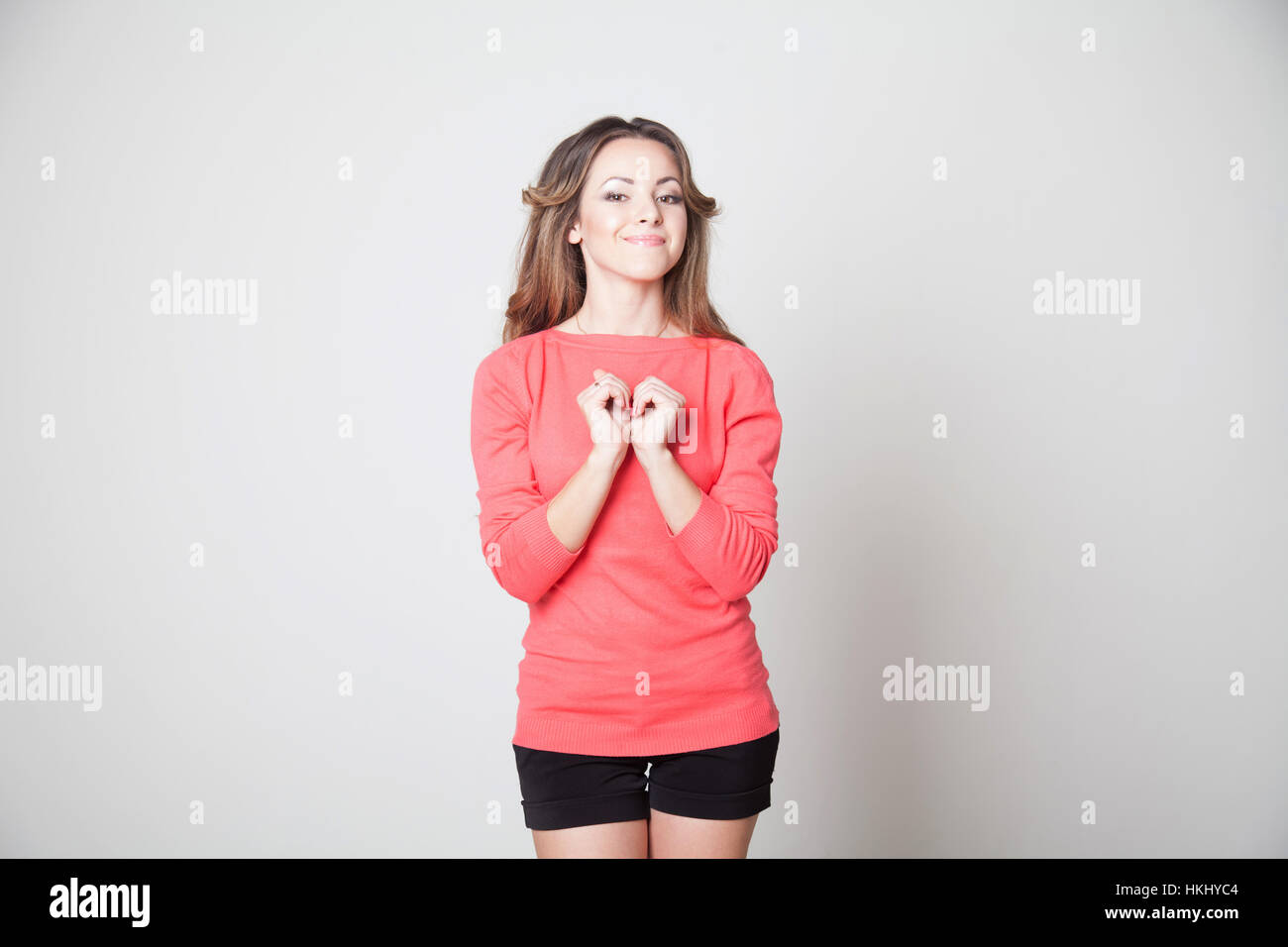 beautiful girl shows hands symbol heart Stock Photo - Alamy