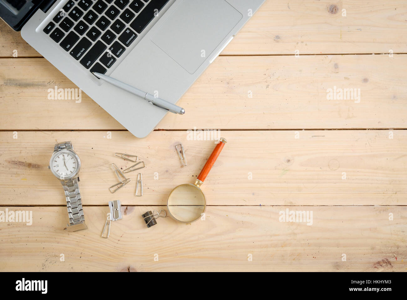 Wooden desk with various gadgets and accessories Stock Photo - Alamy