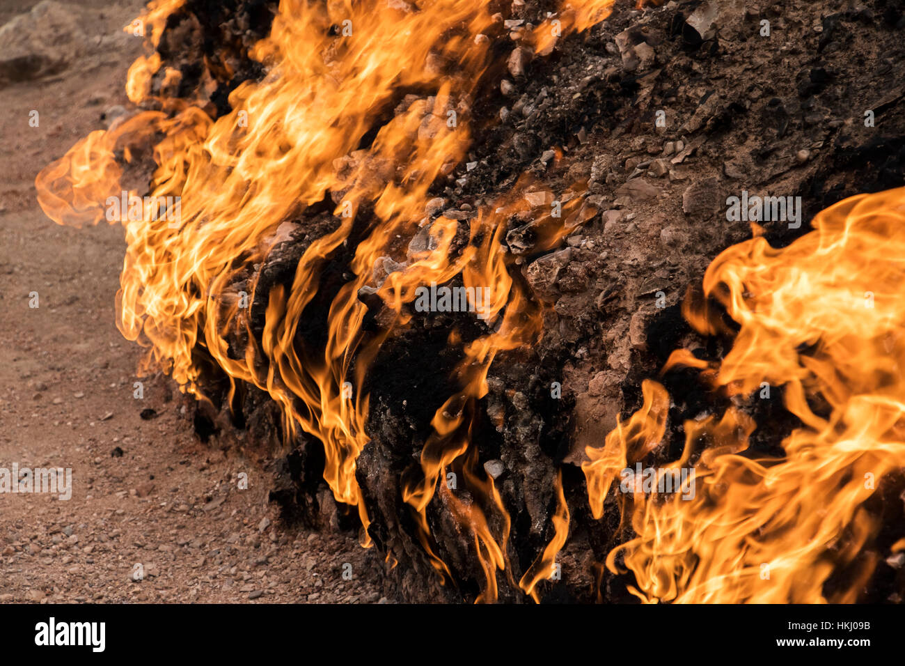 Natural gas fire which blazes continuously on a hillside, Yanar Dag ...