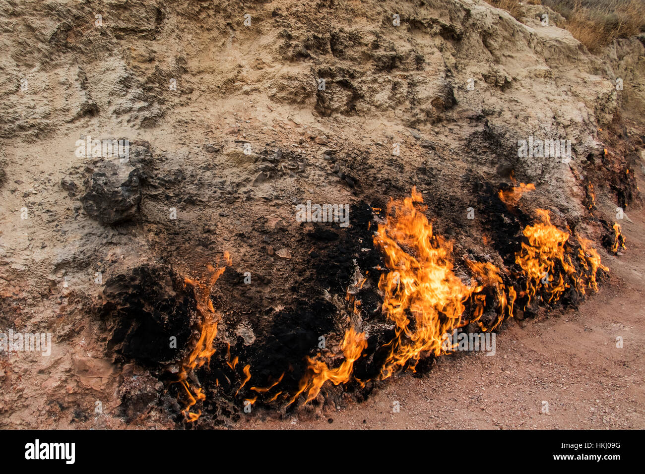 Natural gas fire which blazes continuously on a hillside, Yanar Dag ...