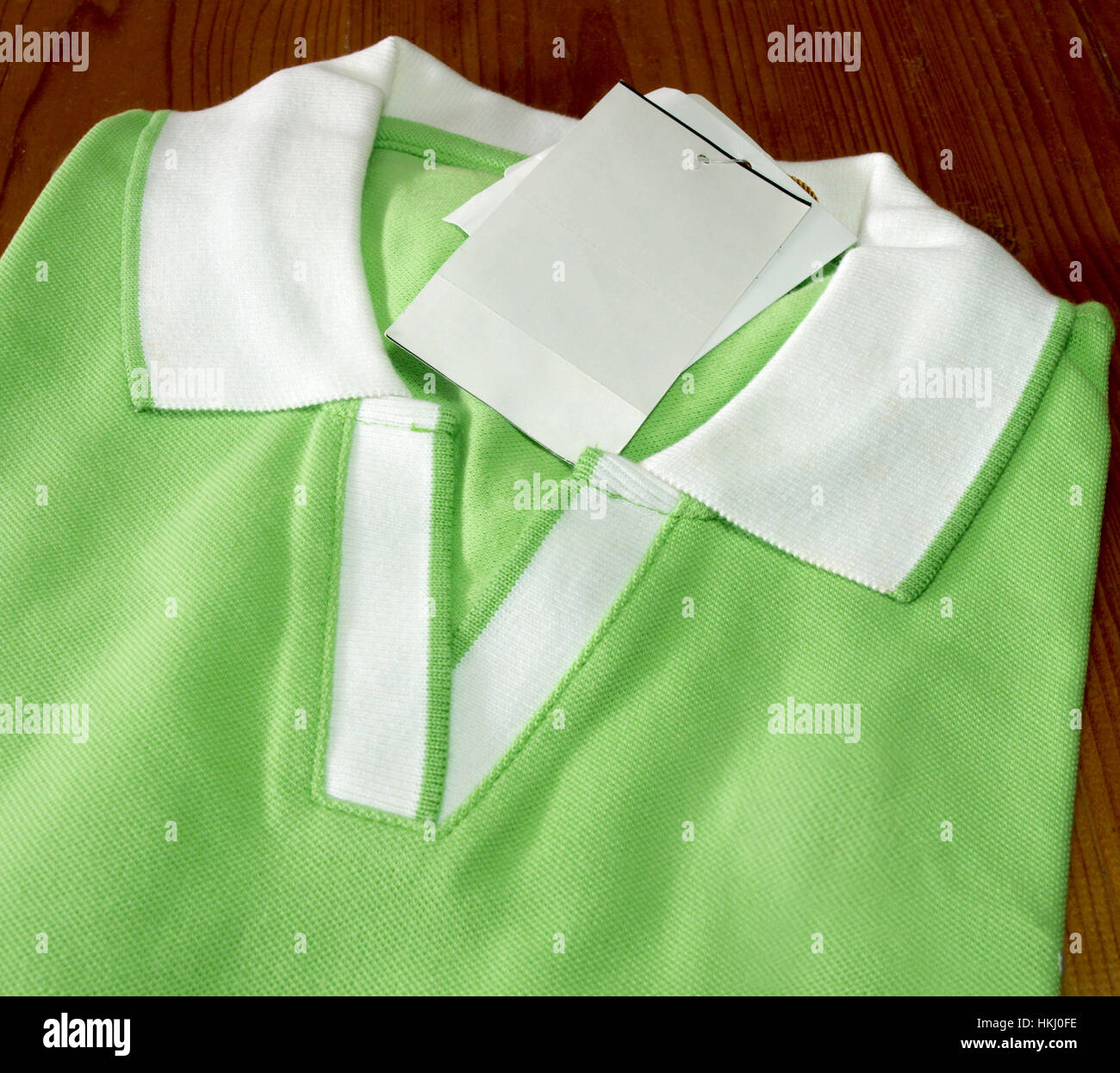 New polo shirt and white label, textile background Stock Photo - Alamy