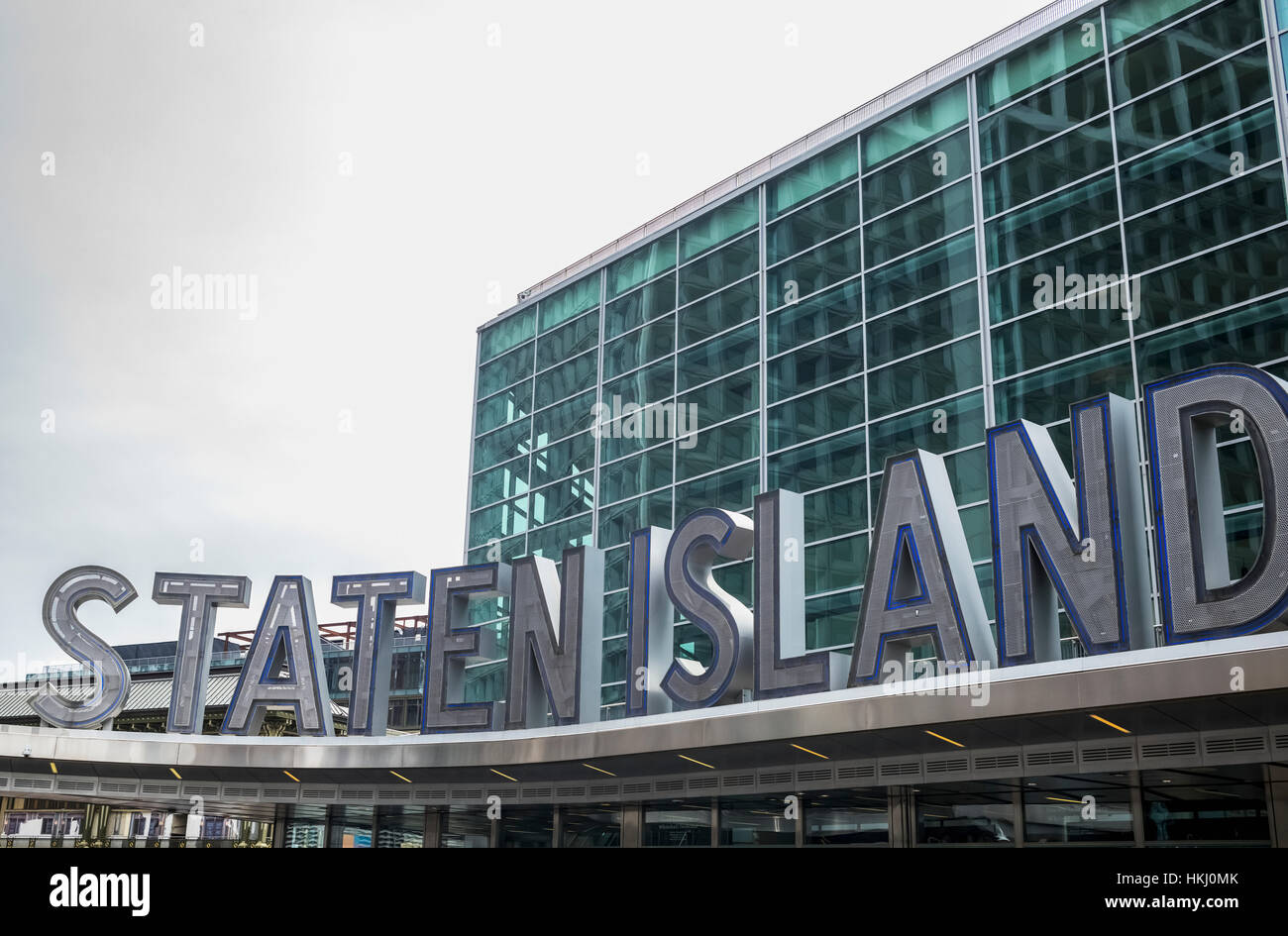 Sign for Staten Island at the ferry terminal with a glass facade ...