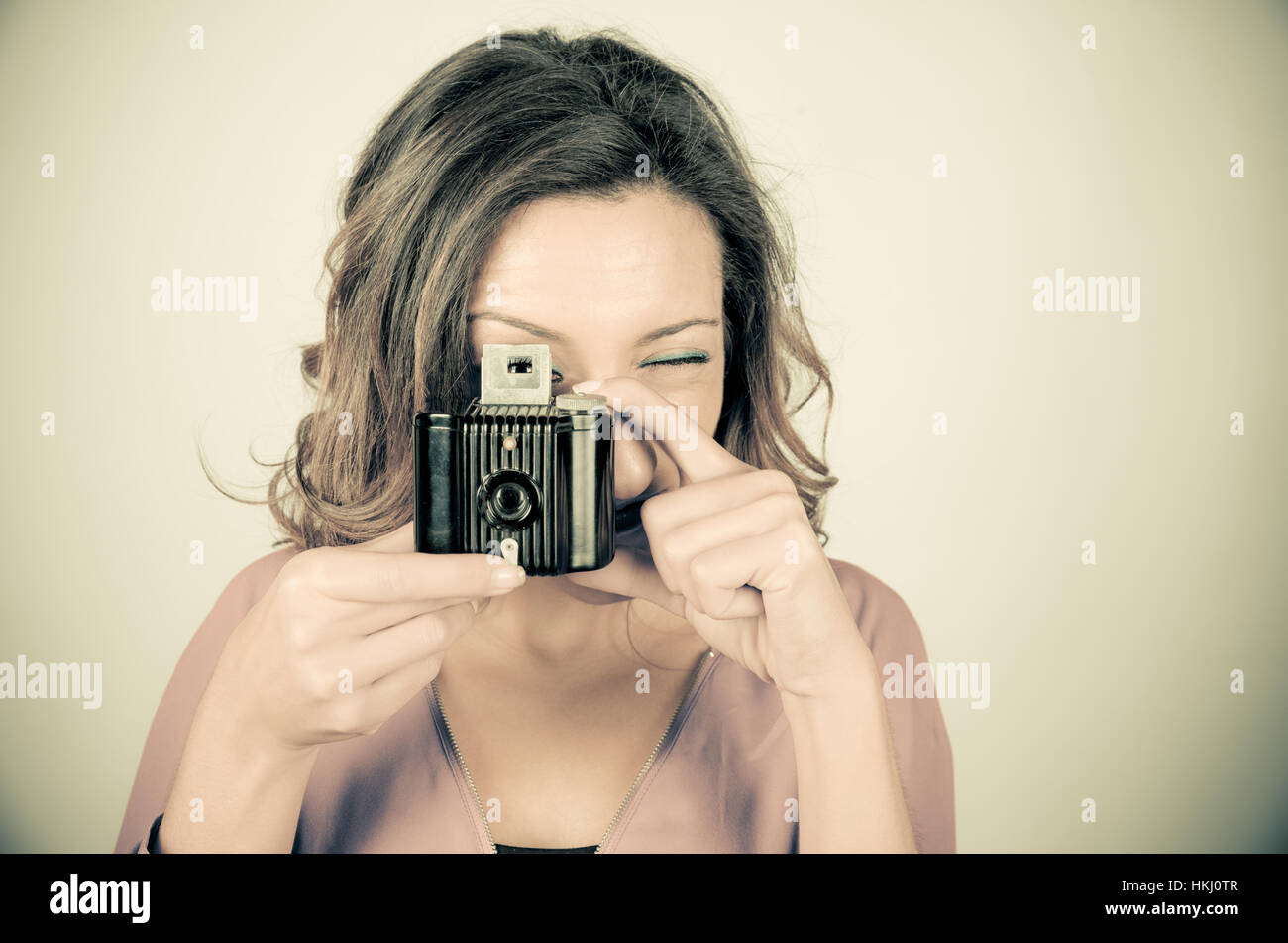 Female photographer using a retro camera from the 1920s Stock Photo - Alamy