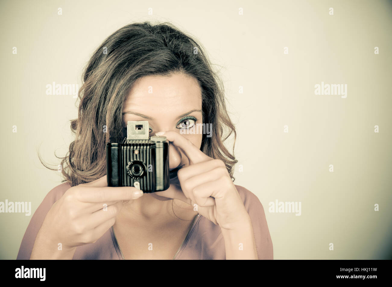 Female photographer using a retro camera from the 1920s Stock Photo - Alamy