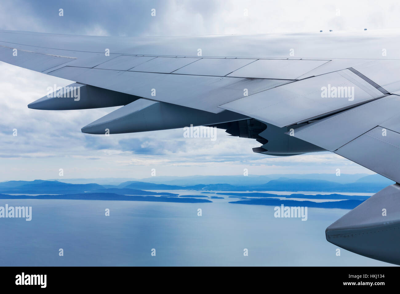 Airplane approaching over ocean in hi-res stock photography and images ...