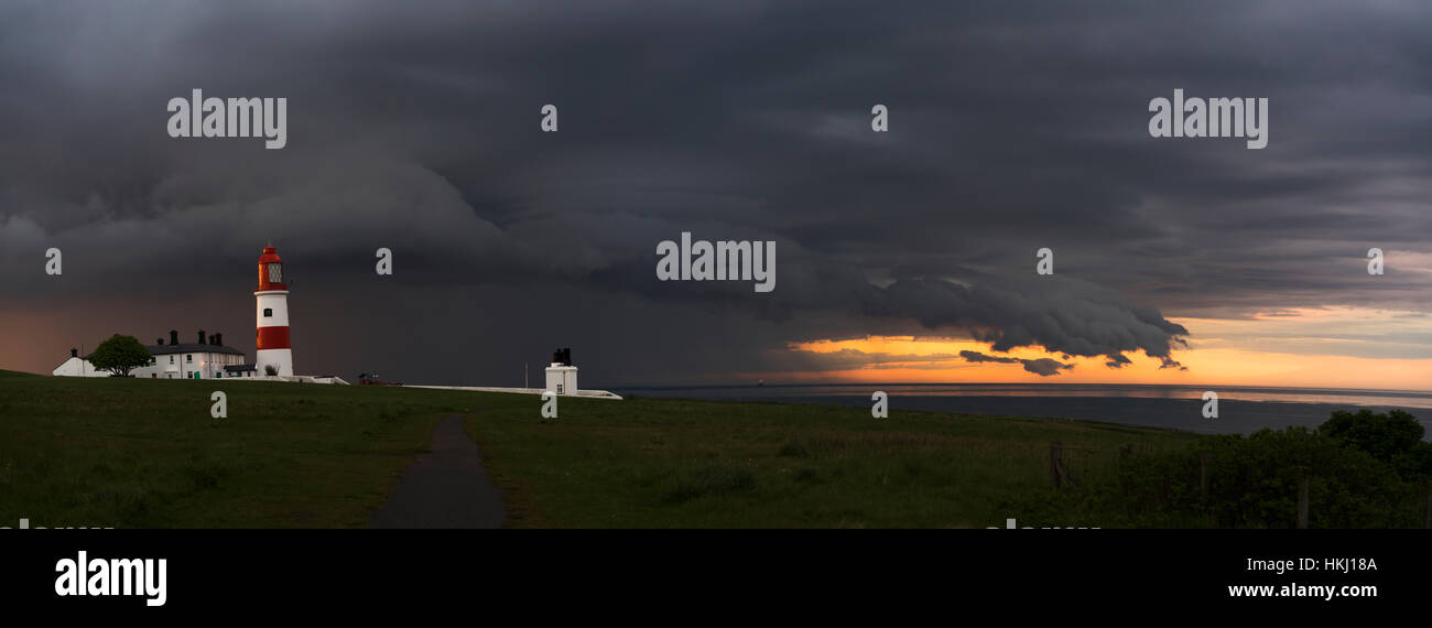 Souter Lighthouse under ominous storm clouds; South Shields, Tyne and ...