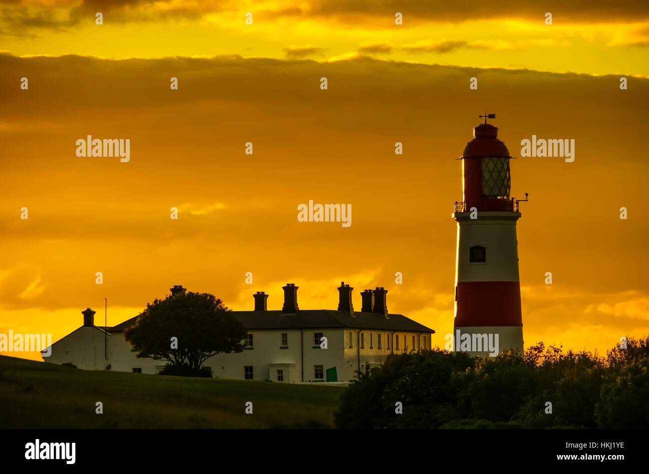 Souter Lighthouse under a glowing golden sky at sunset; South Shields ...