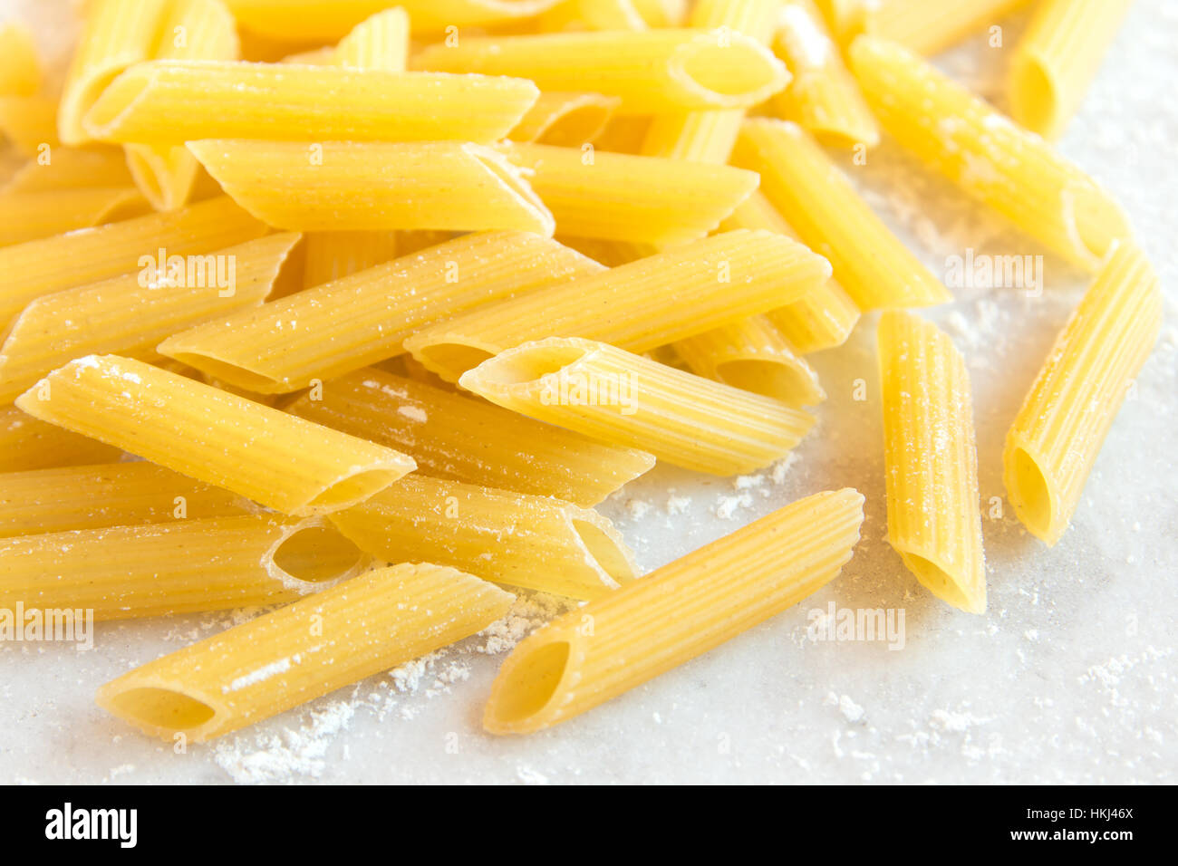 Assorted italian Raw Uncooked Pasta on white background with copy space ...