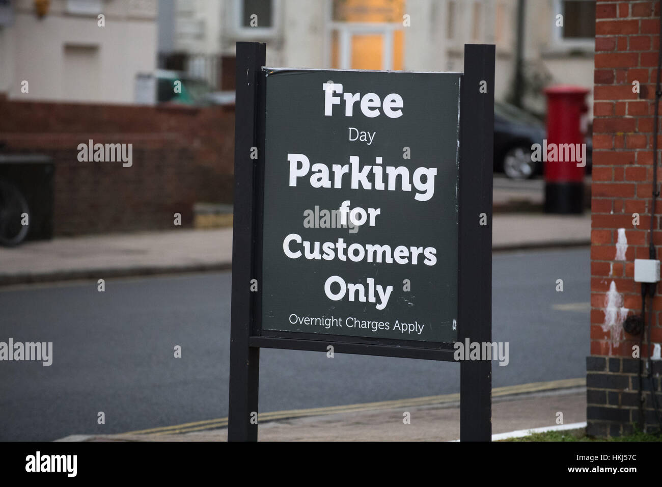 Free parking for customers only sign Stock Photo - Alamy