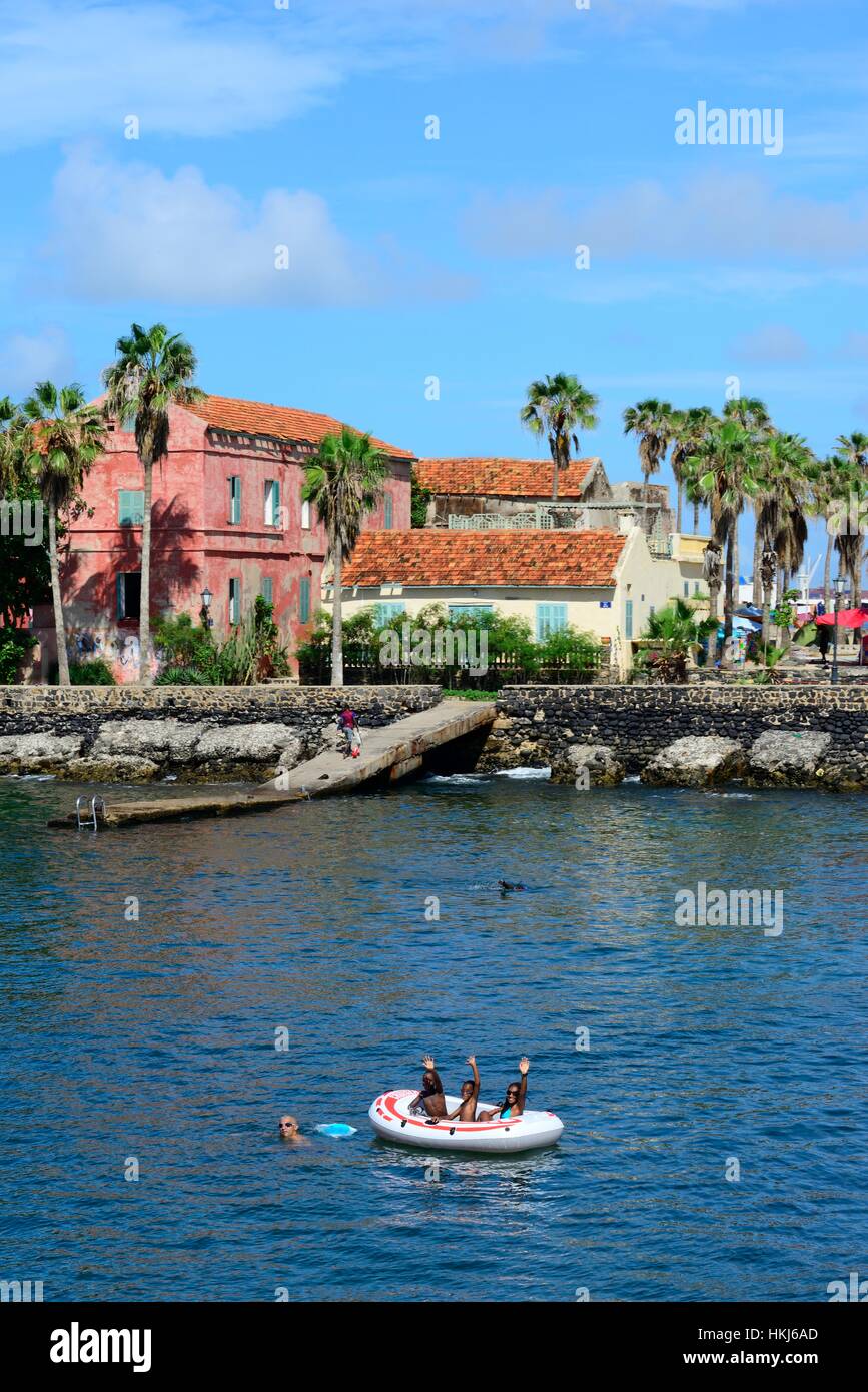 Palm trees and colonial building at the harbor, Île de Gorée, Dakar ...