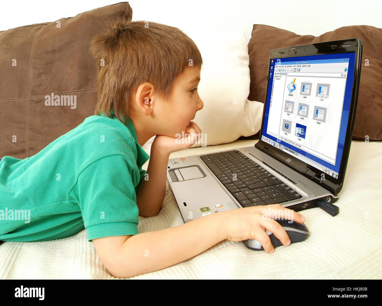 Boy using laptop Stock Photo - Alamy