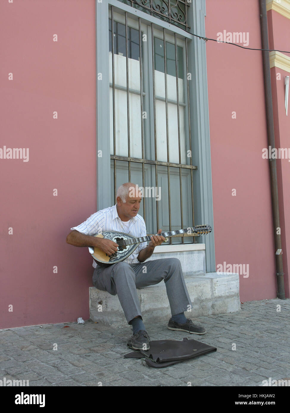Street musician in old town Plaka with traditional folk instrument ...