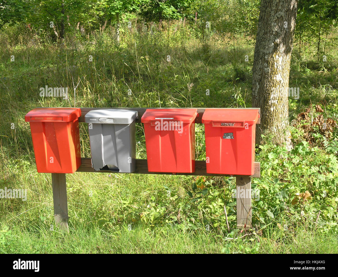 Series of red letter boxes on countryside highway Finland Scandinavia ...