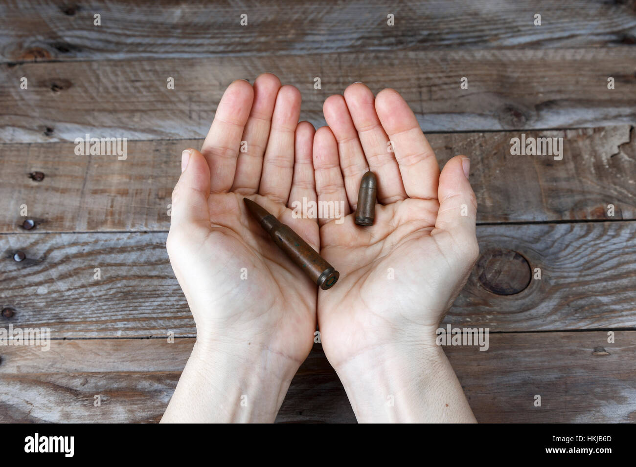 Bullet on hands hi-res stock photography and images - Alamy