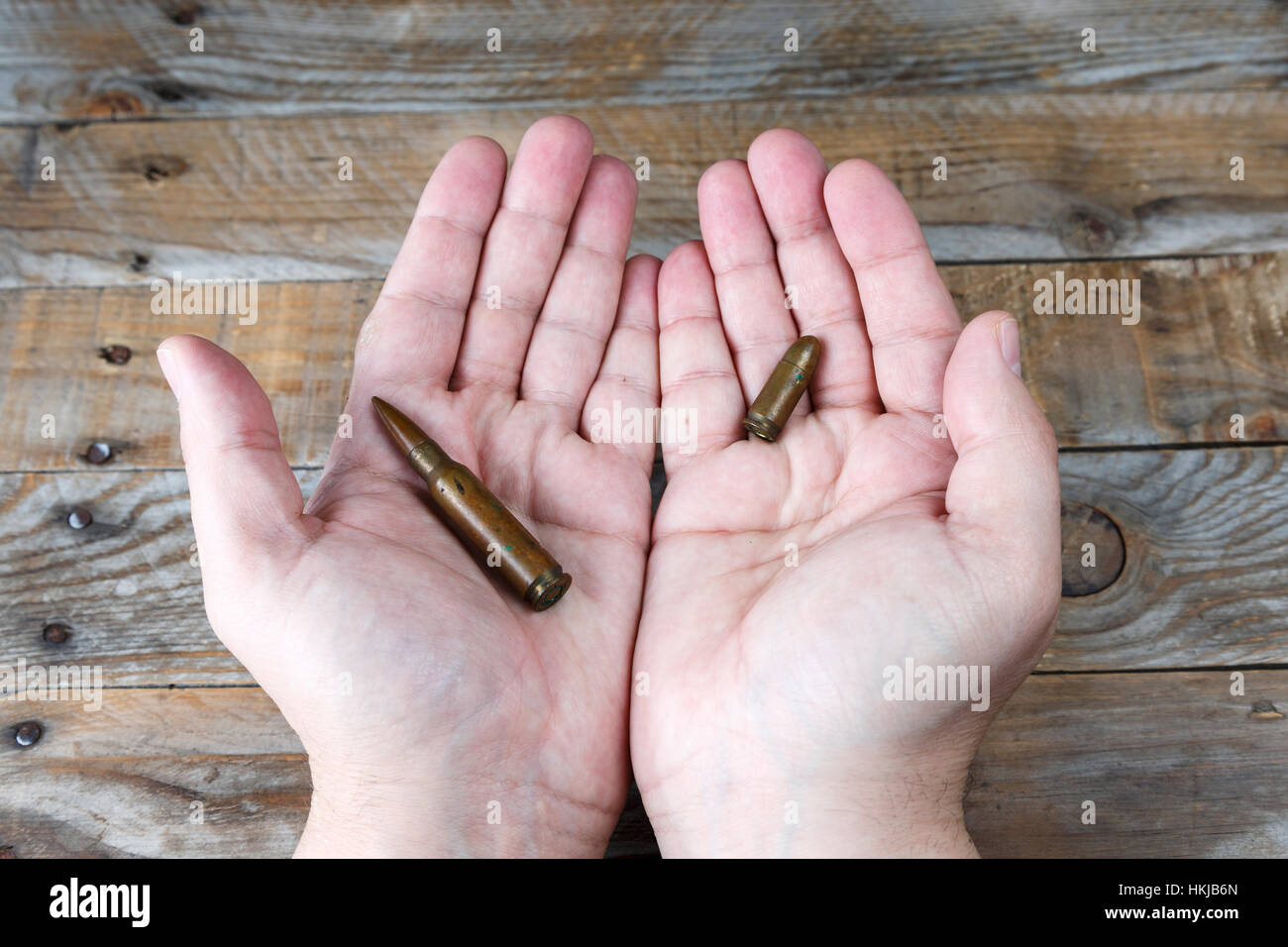 Bullet on hands hi-res stock photography and images - Alamy