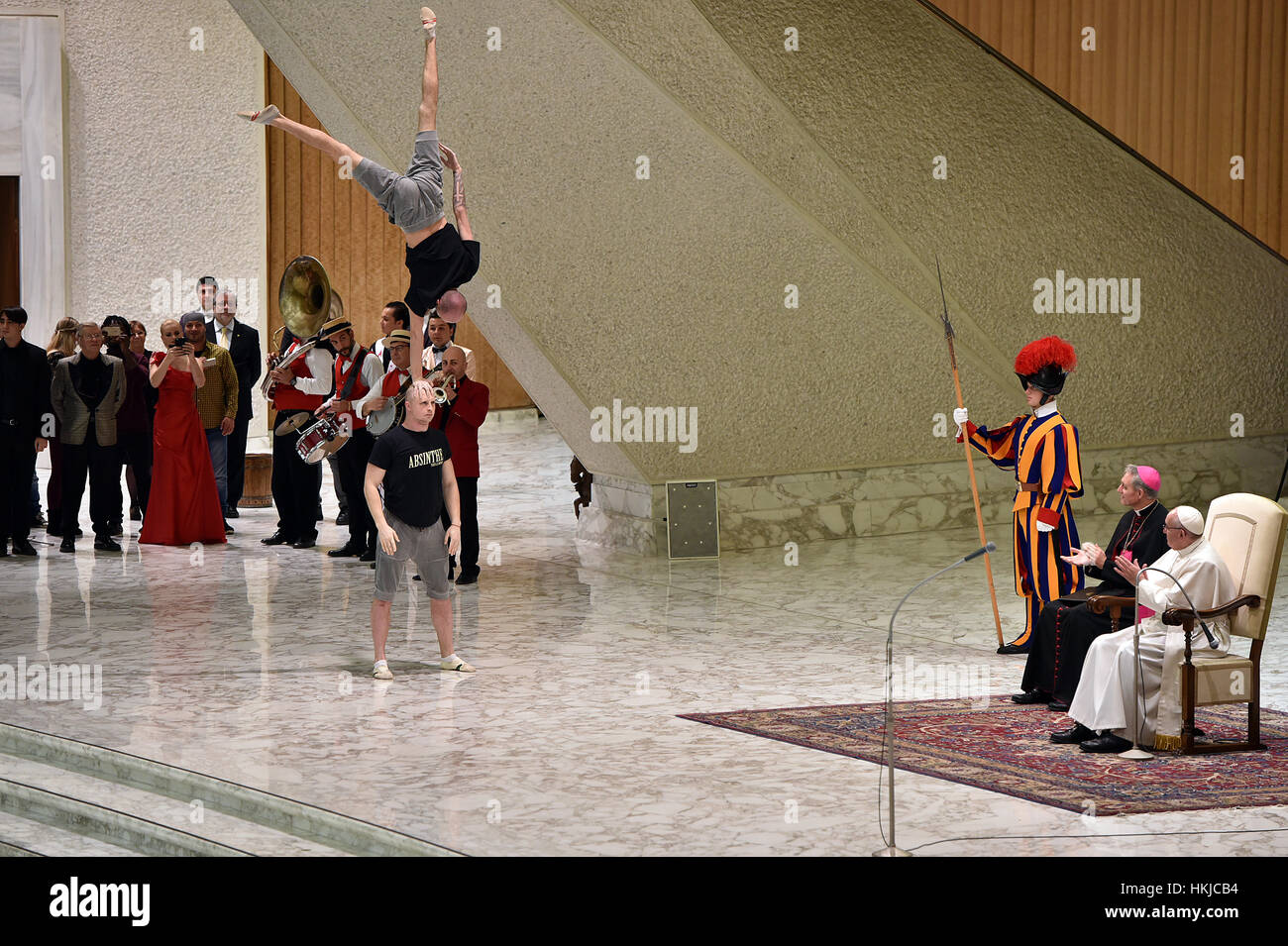 Pope Francis looks at a performance of a member of the Golden Circus in ...