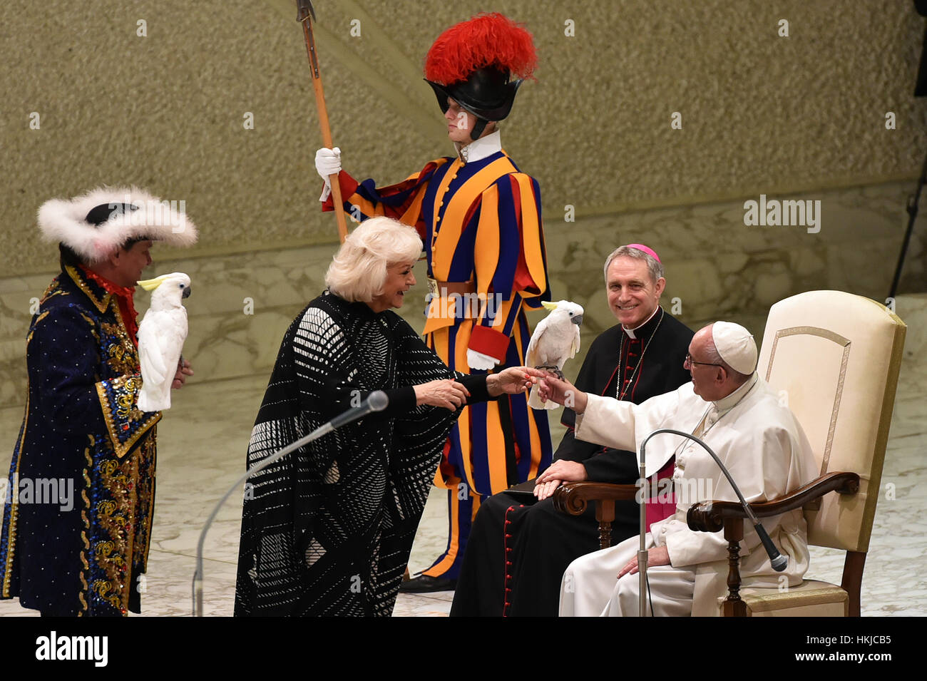 Pope Francis holds a parrot during a performance of the Golden Circus ...