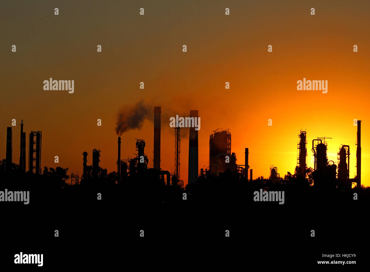 View of crude oil refinery during sunset Stock Photo - Alamy