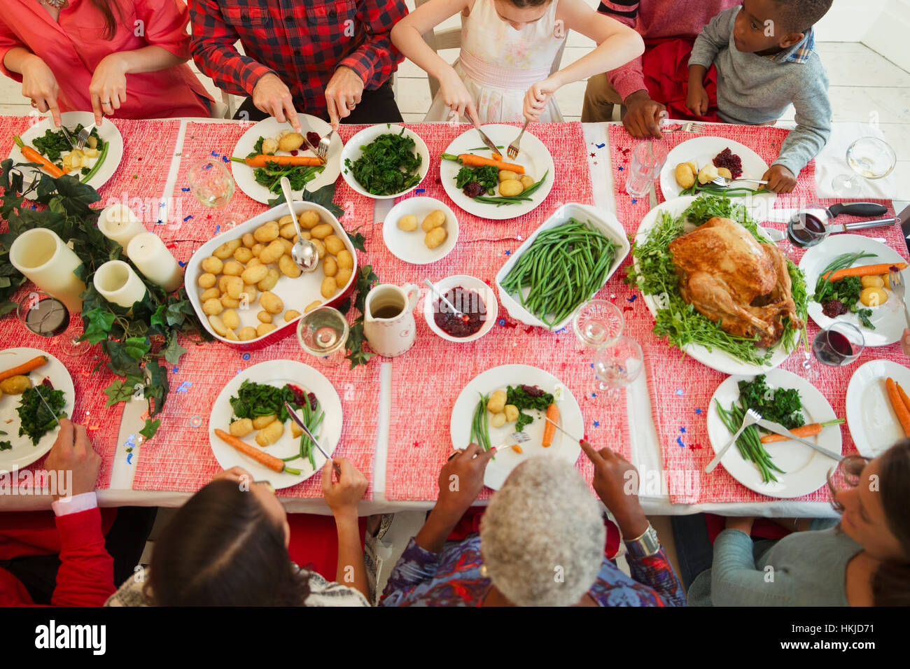 Overhead view family eating Christmas dinner Stock Photo - Alamy