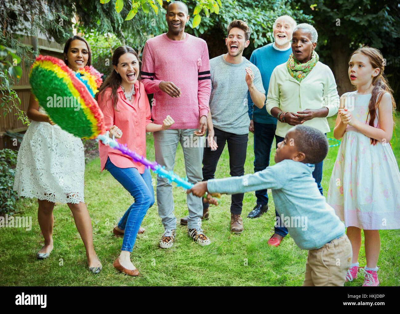 Boy hitting pinata hi-res stock photography and images - Alamy