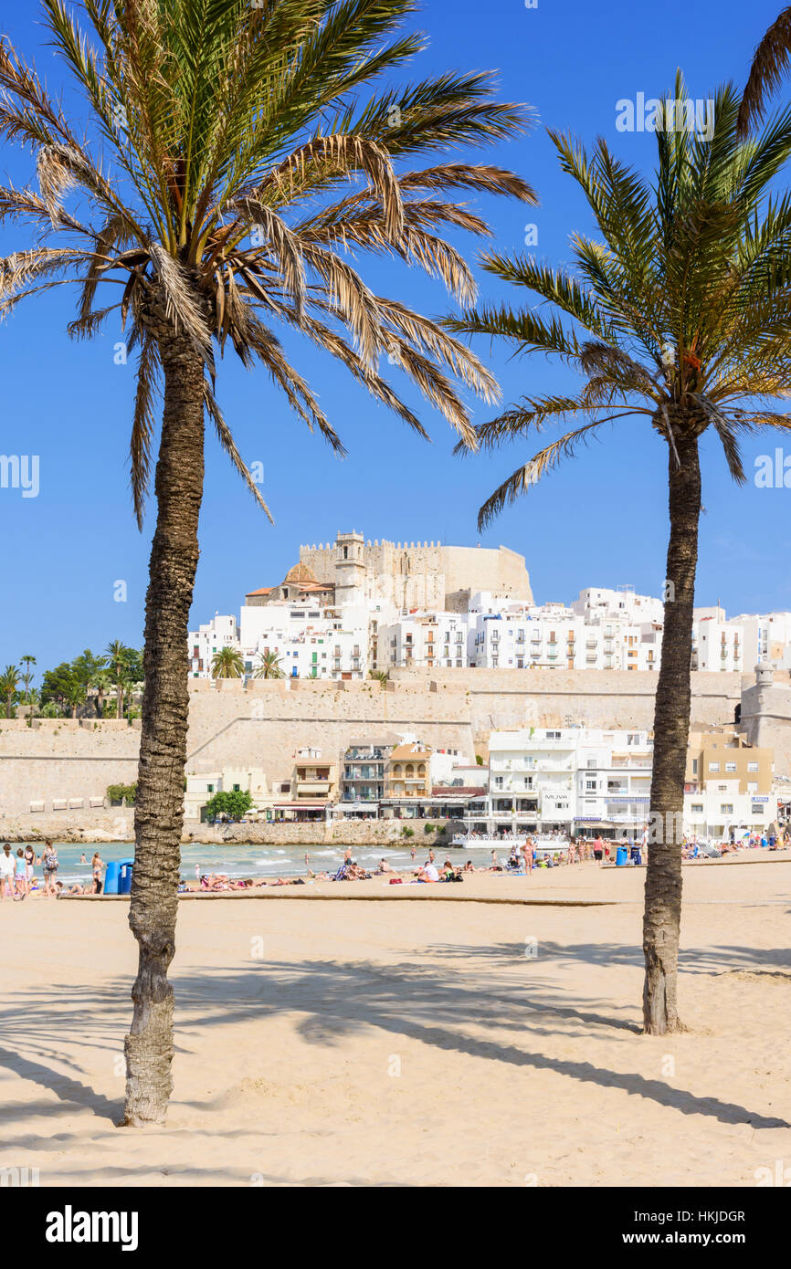 Palm tree framed Papa Luna Castle and old town overlooking people on ...