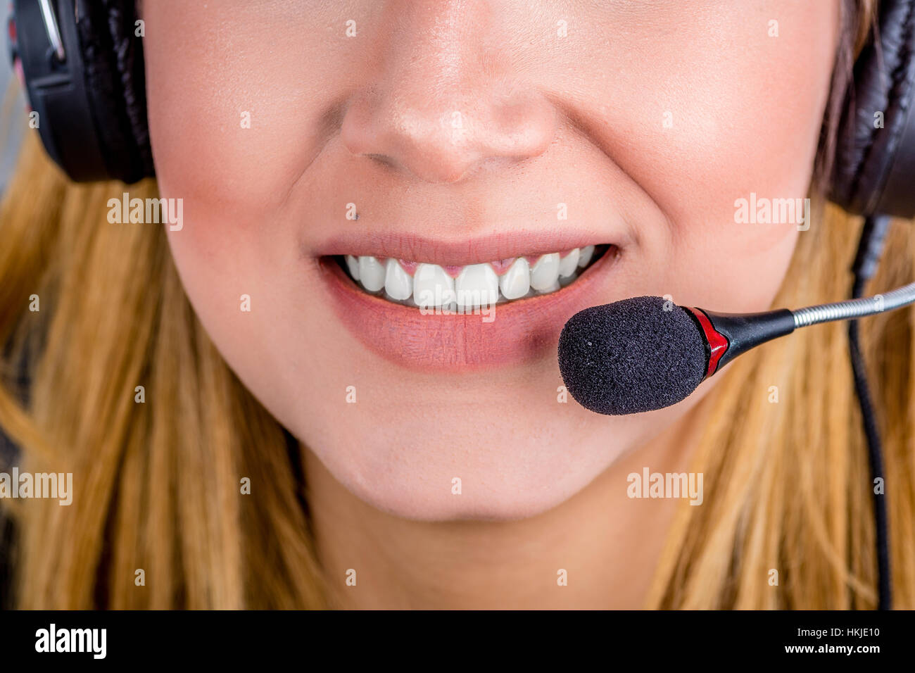 Beautiful young Egyptian call-center assistant smiling Stock Photo - Alamy
