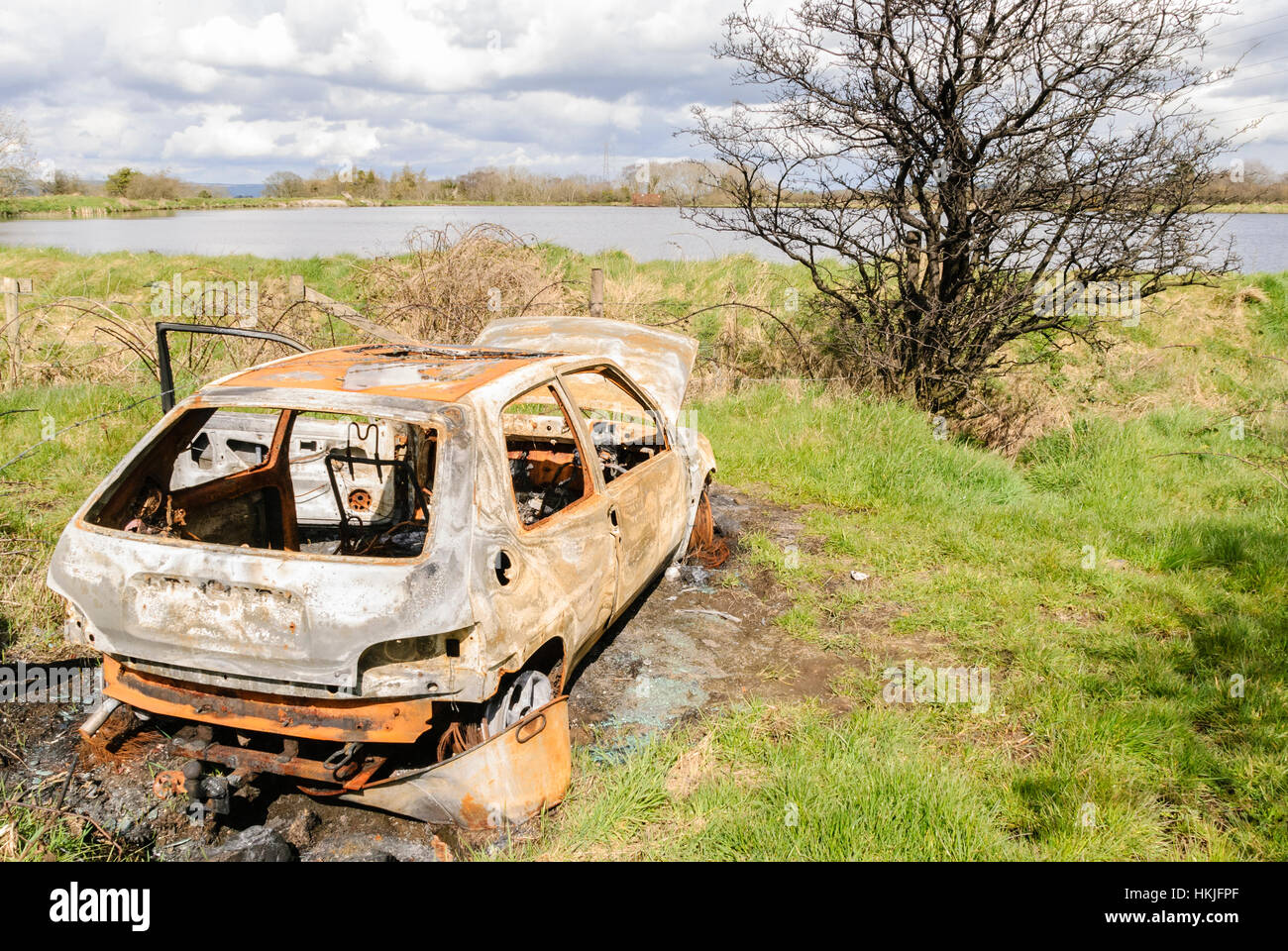 Burned out car in a country lane Stock Photo - Alamy