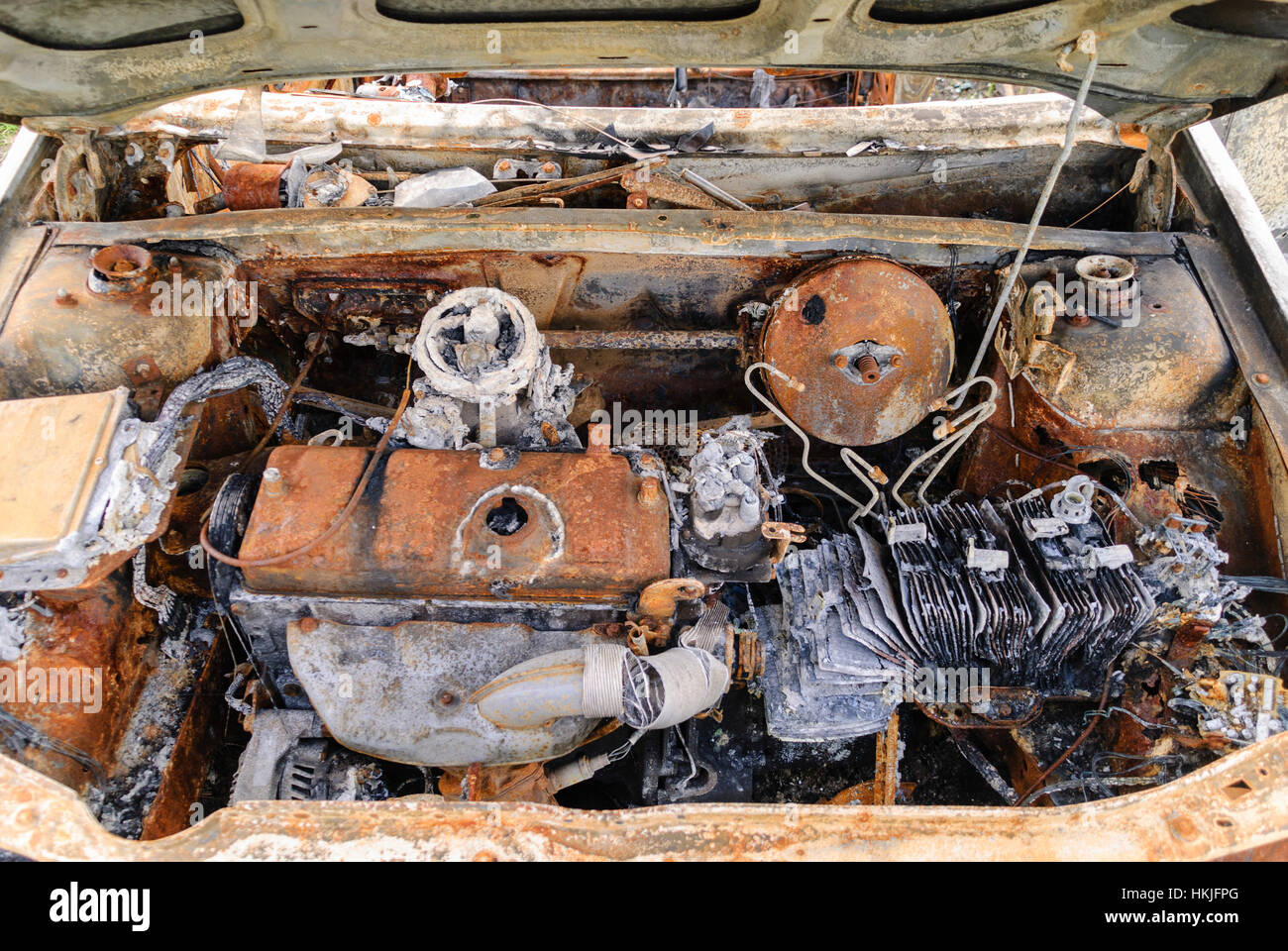 Engine bay of a burned out car in a country lane Stock Photo - Alamy