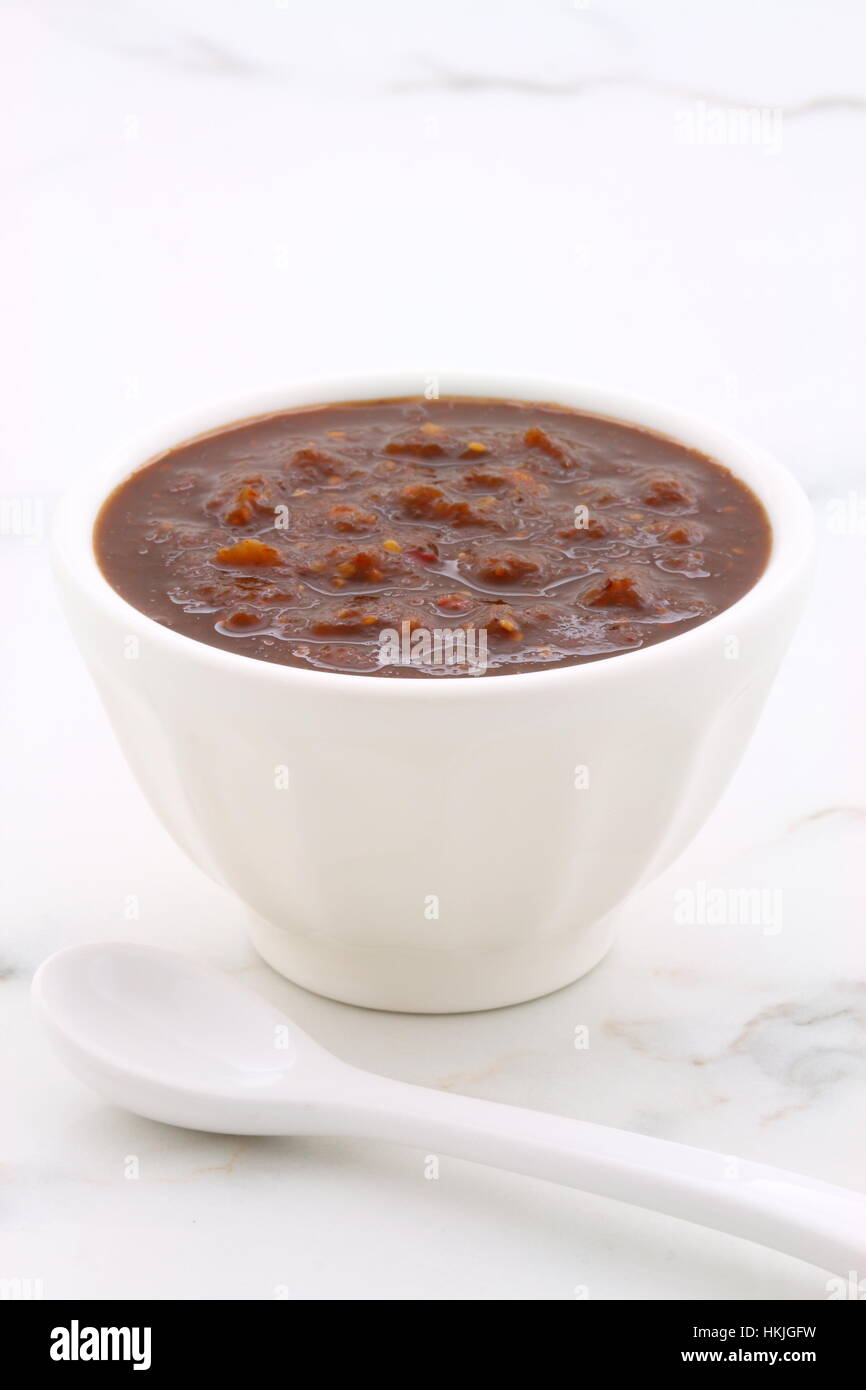 Artisan mexican chipotle sauce on vintage carrara marble table, with a ...