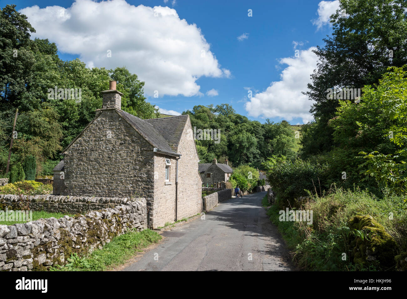 Country lane leading into the village of Milldale in the Peak District ...