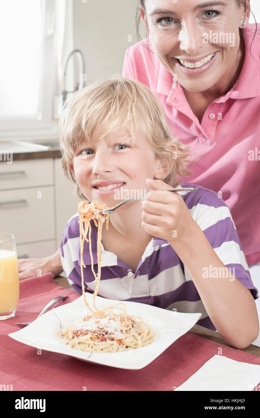 Two boys eating spaghetti hi-res stock photography and images - Alamy