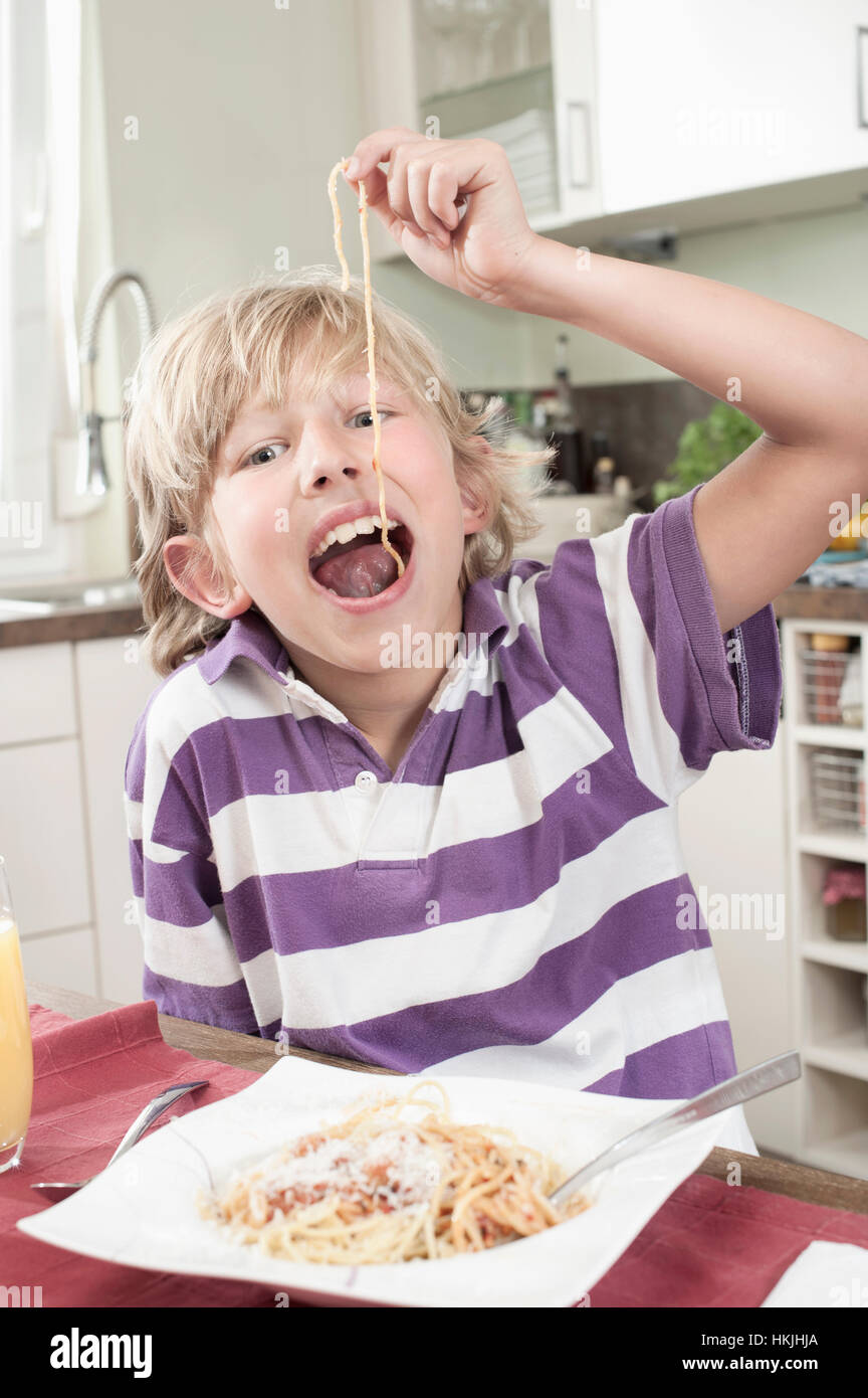 Portrait of a boy eating spaghetti in funny way,Bavaria,Germany Stock ...