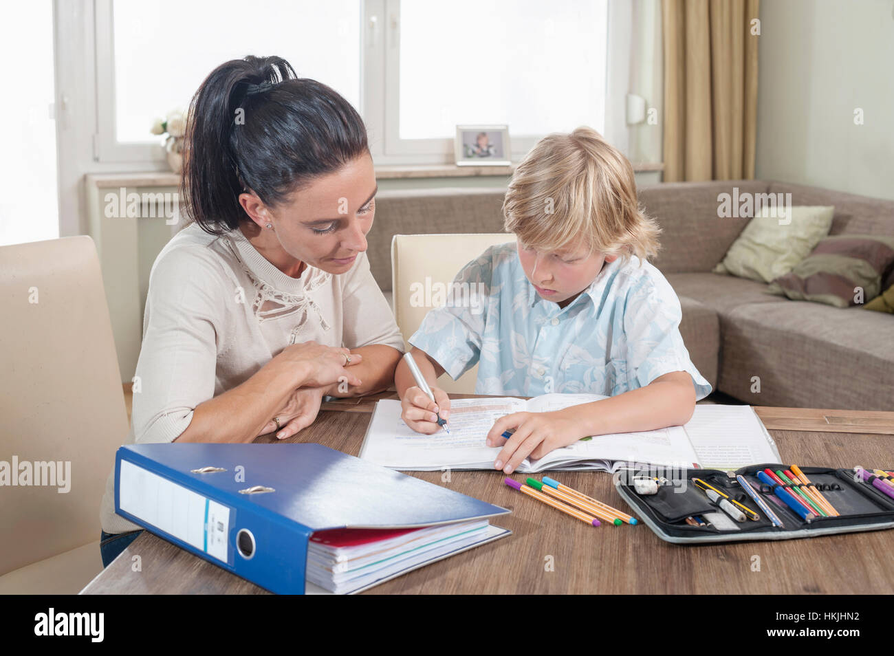 Helping his son to do homework hi-res stock photography and images - Alamy