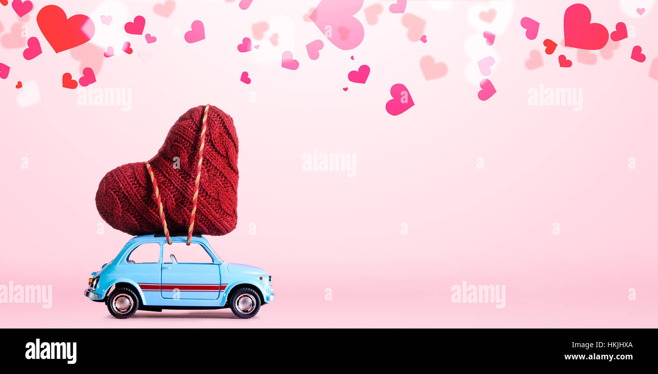 Retro toy car with Valentine heart Stock Photo - Alamy