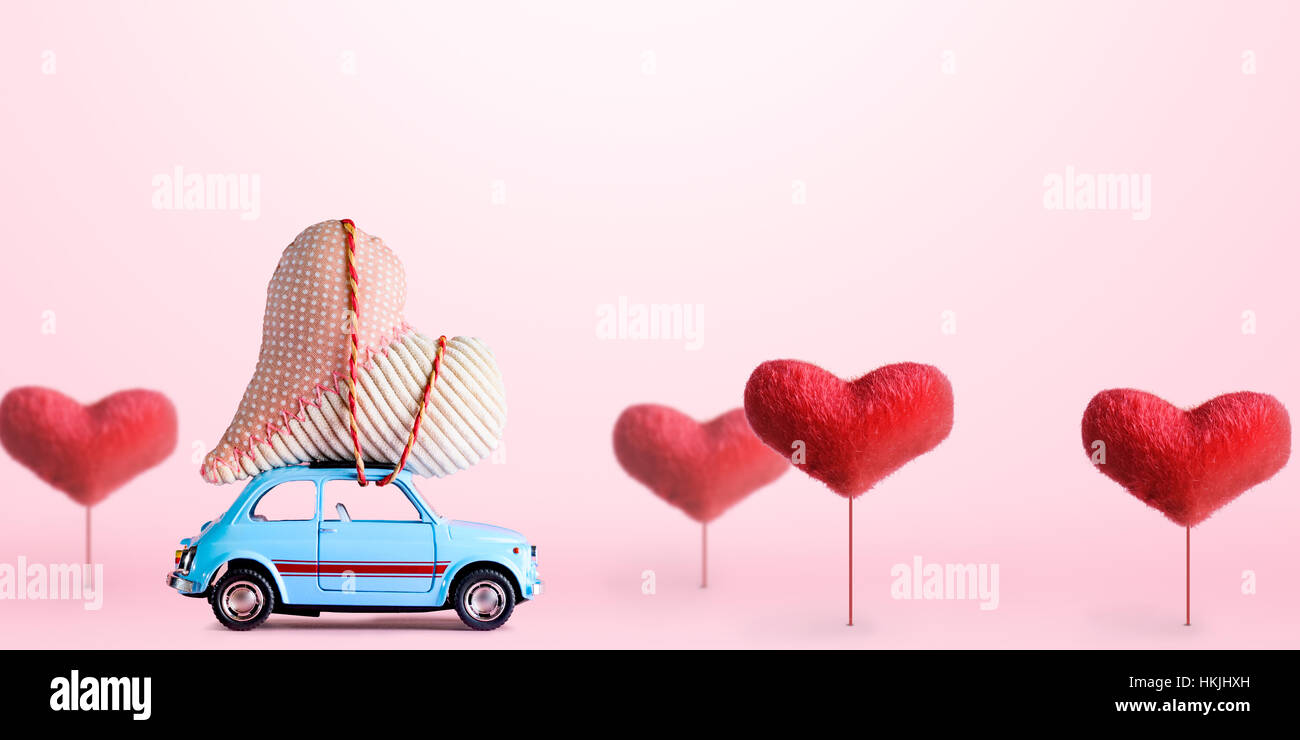 Retro toy car with Valentine heart Stock Photo - Alamy