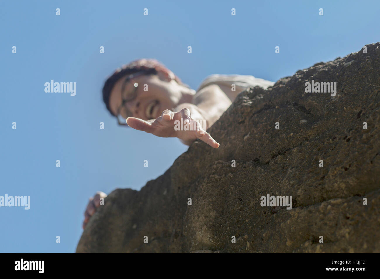 Mature woman stretching hand to help someone, Freiburg im Breisgau ...